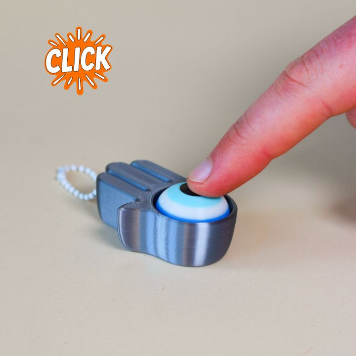 3D Printable TLOU Ellie's Bracelet Fidget Clicker - Keychain - Hamsa Eye by Clickify 3D